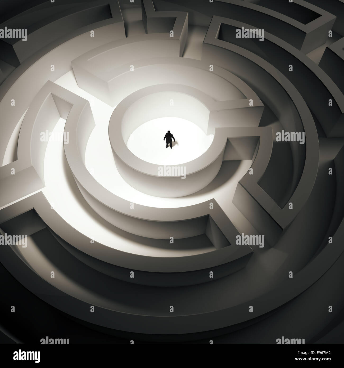 Tiny man inside an endless maze Stock Photo - Alamy