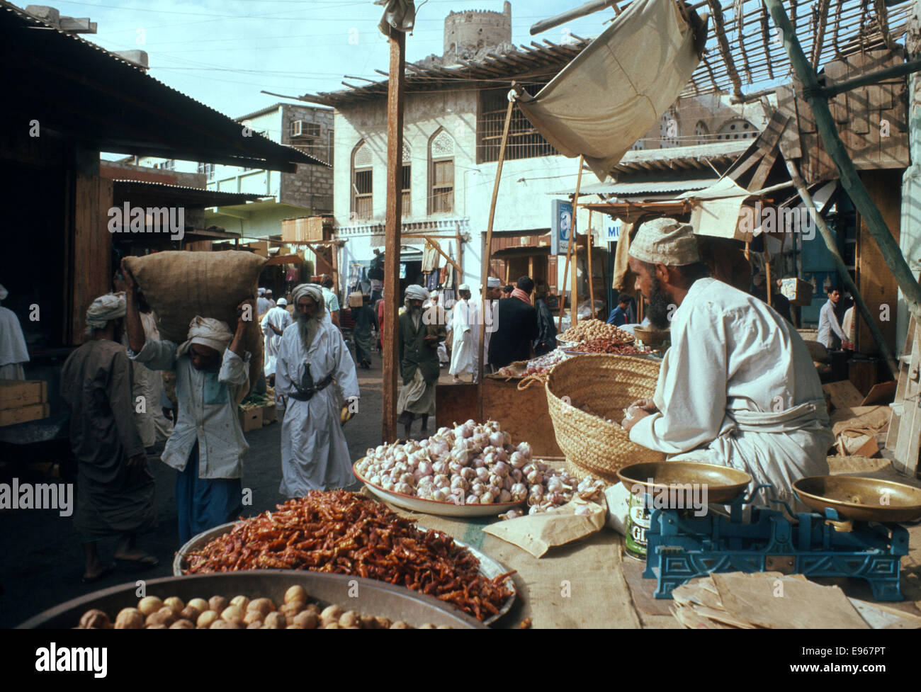 A trader outside the entrance into Muttrah souq, taken in 1975 ...