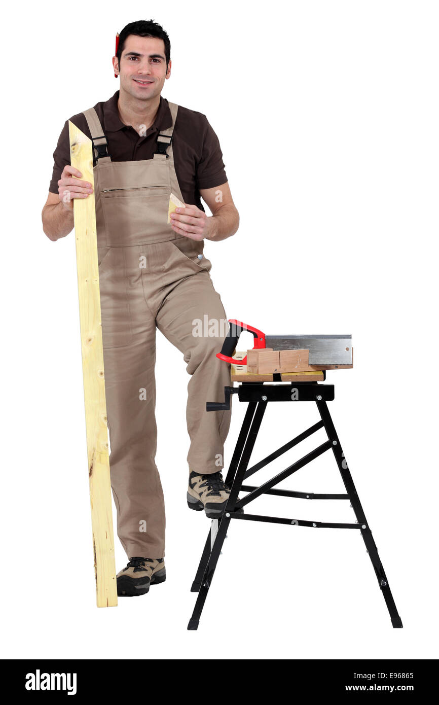 Carpenter with wood Stock Photo - Alamy