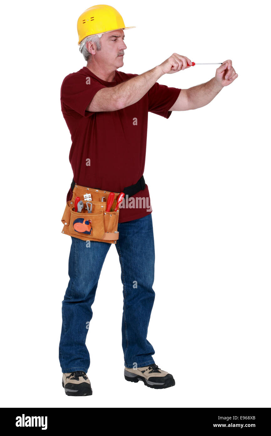 Worker with screw-driver Stock Photo - Alamy