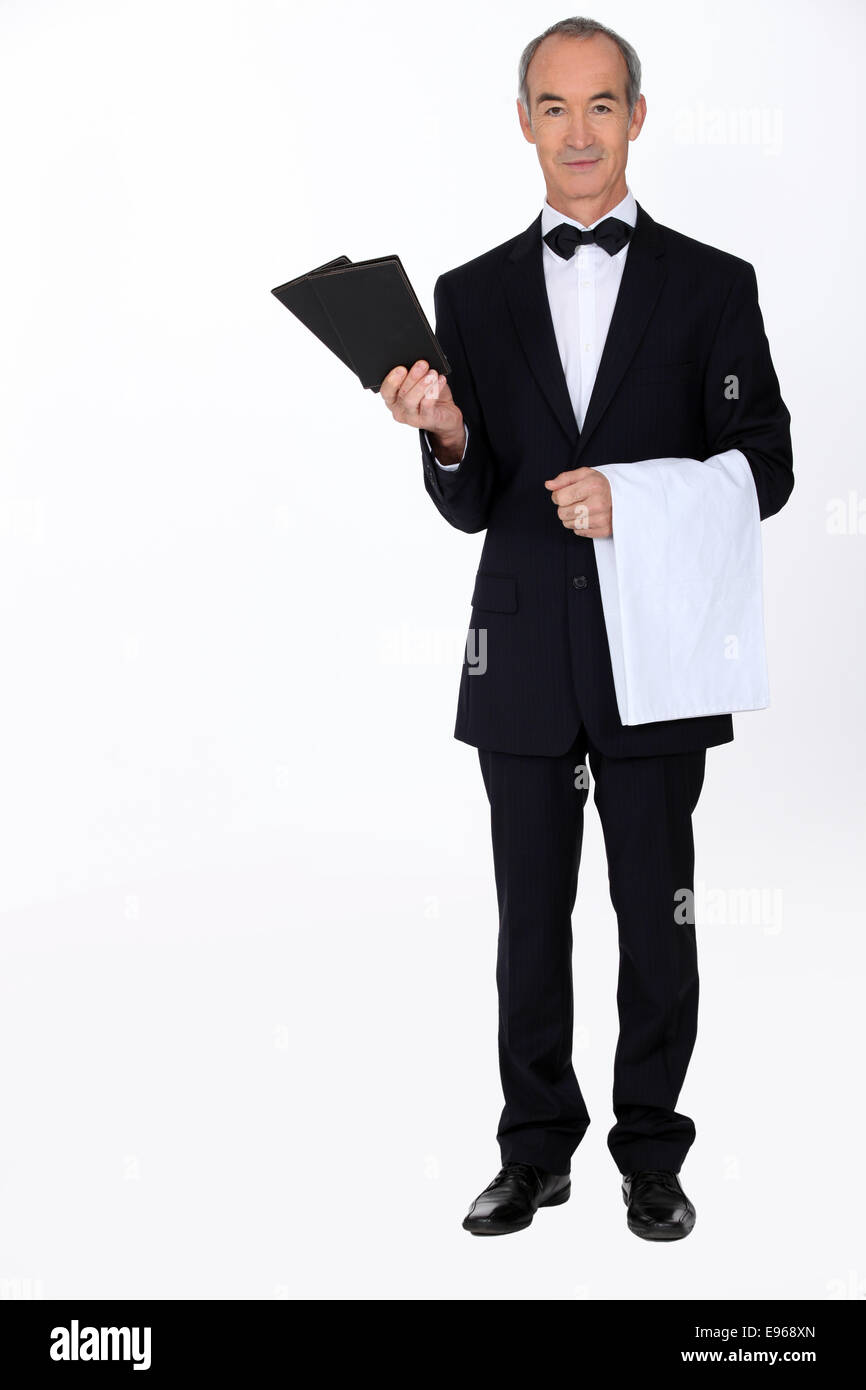Waiter with menus Stock Photo - Alamy