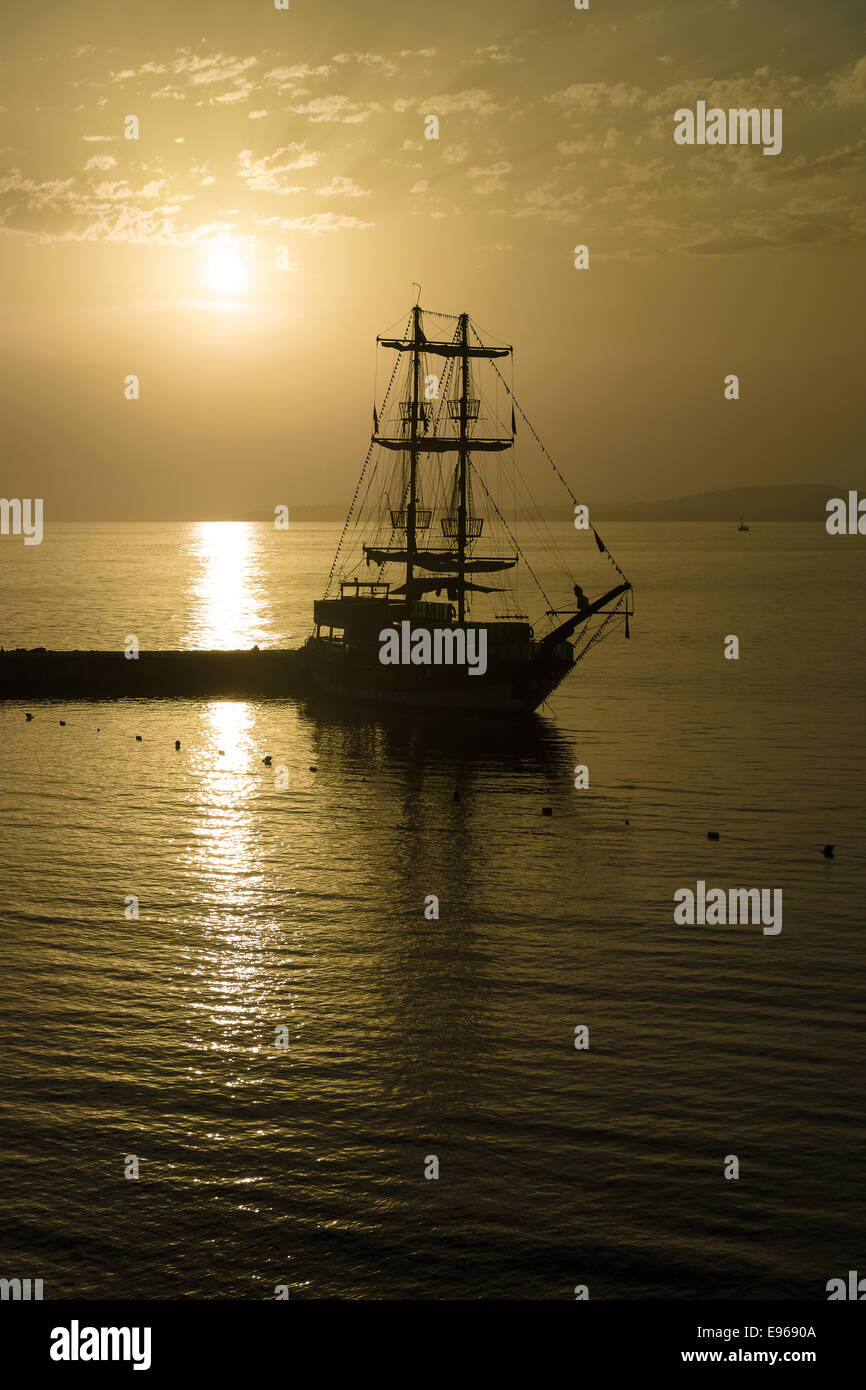 Evening. Sailboat in the bay Stock Photo - Alamy