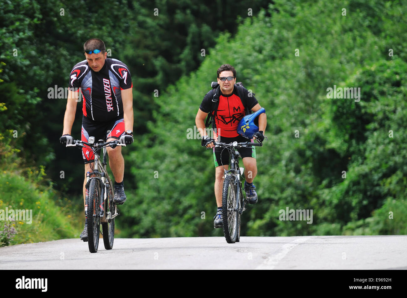 friendship and travel on mountain bike Stock Photo - Alamy