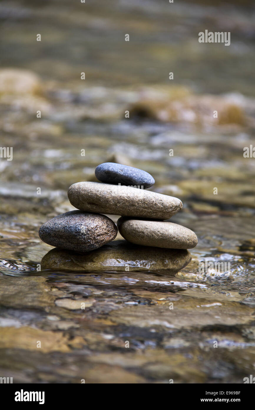 Stack of stones in a river Stock Photo - Alamy