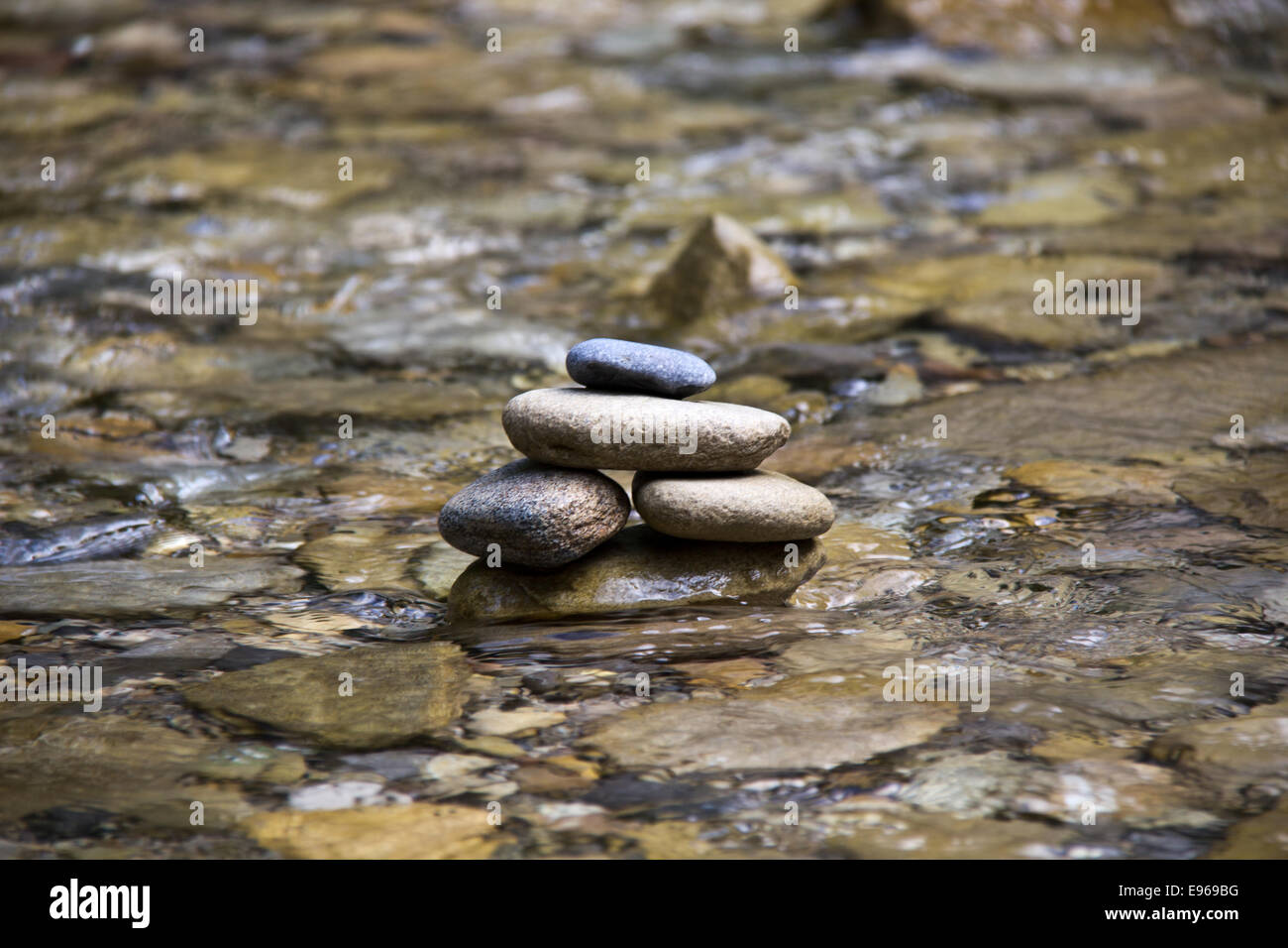 Stack of stones in a river Stock Photo - Alamy