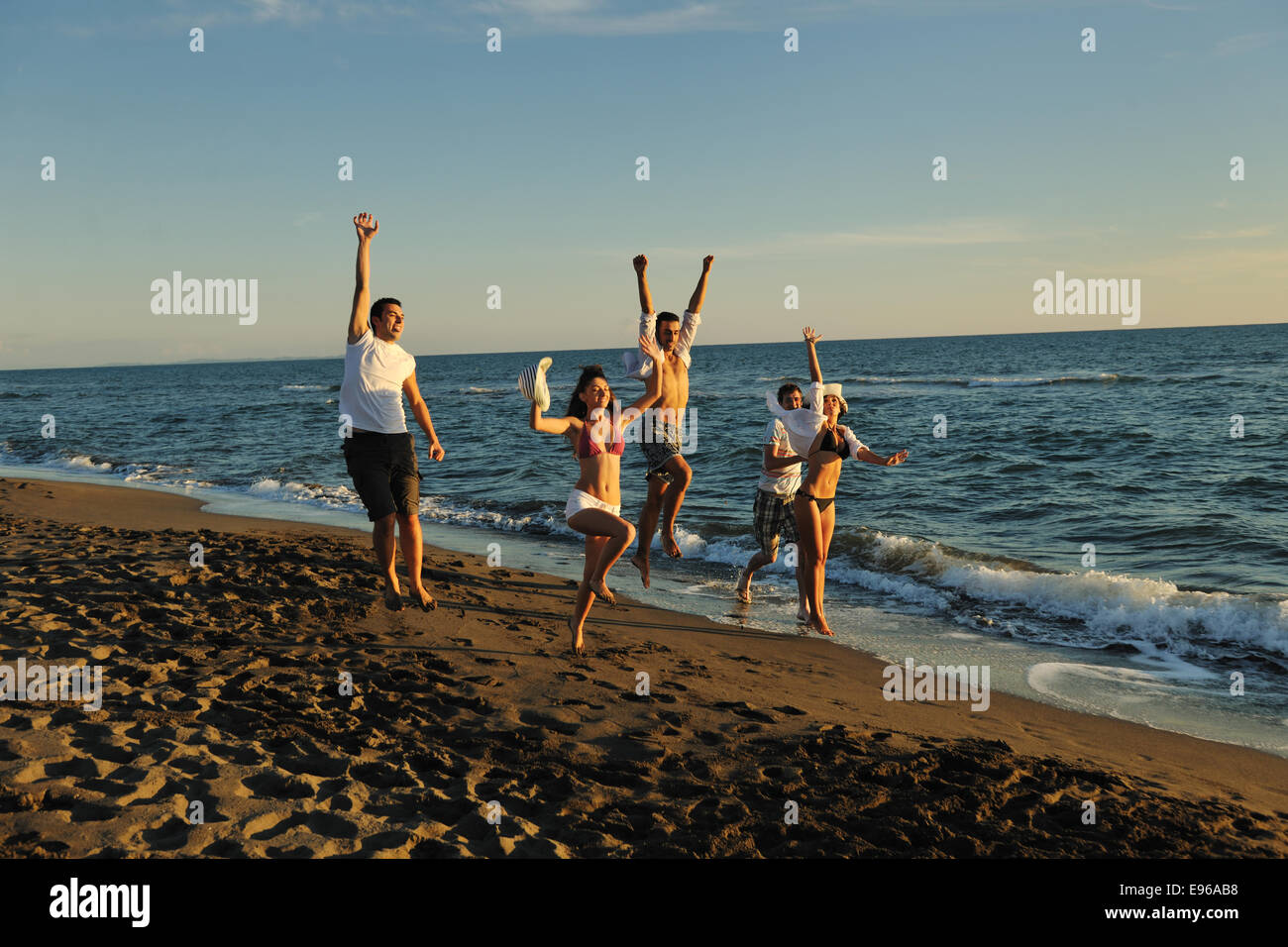 people group running on the beach Stock Photo - Alamy