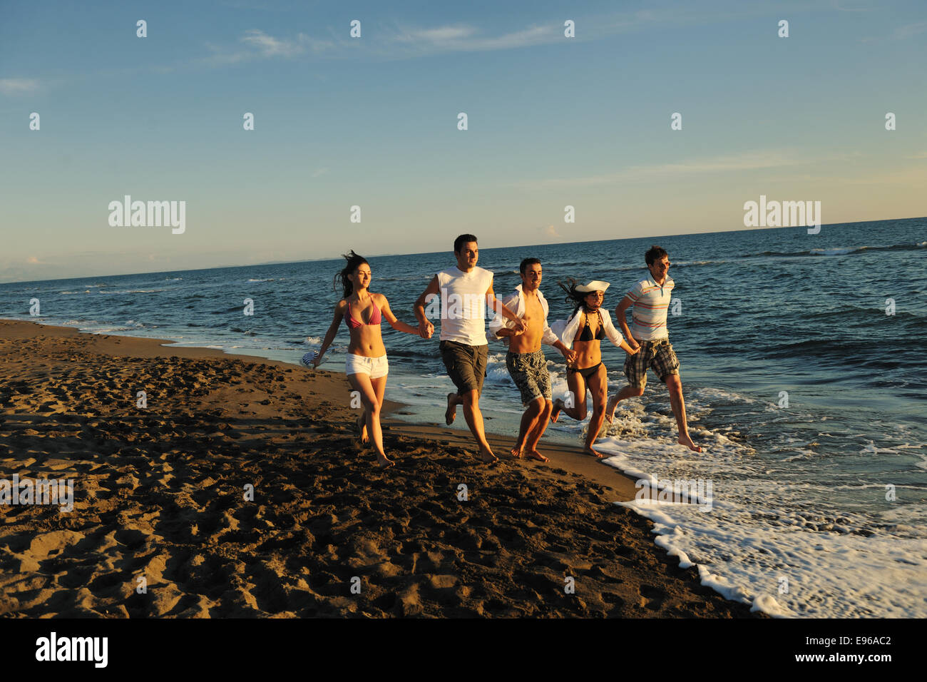 people group running on the beach Stock Photo - Alamy