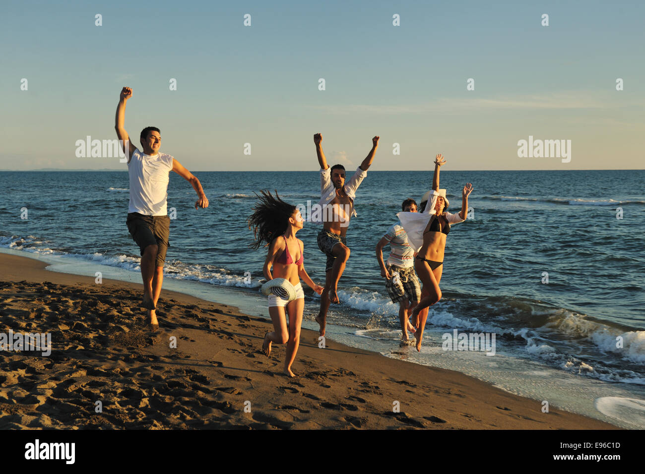 people group running on the beach Stock Photo - Alamy