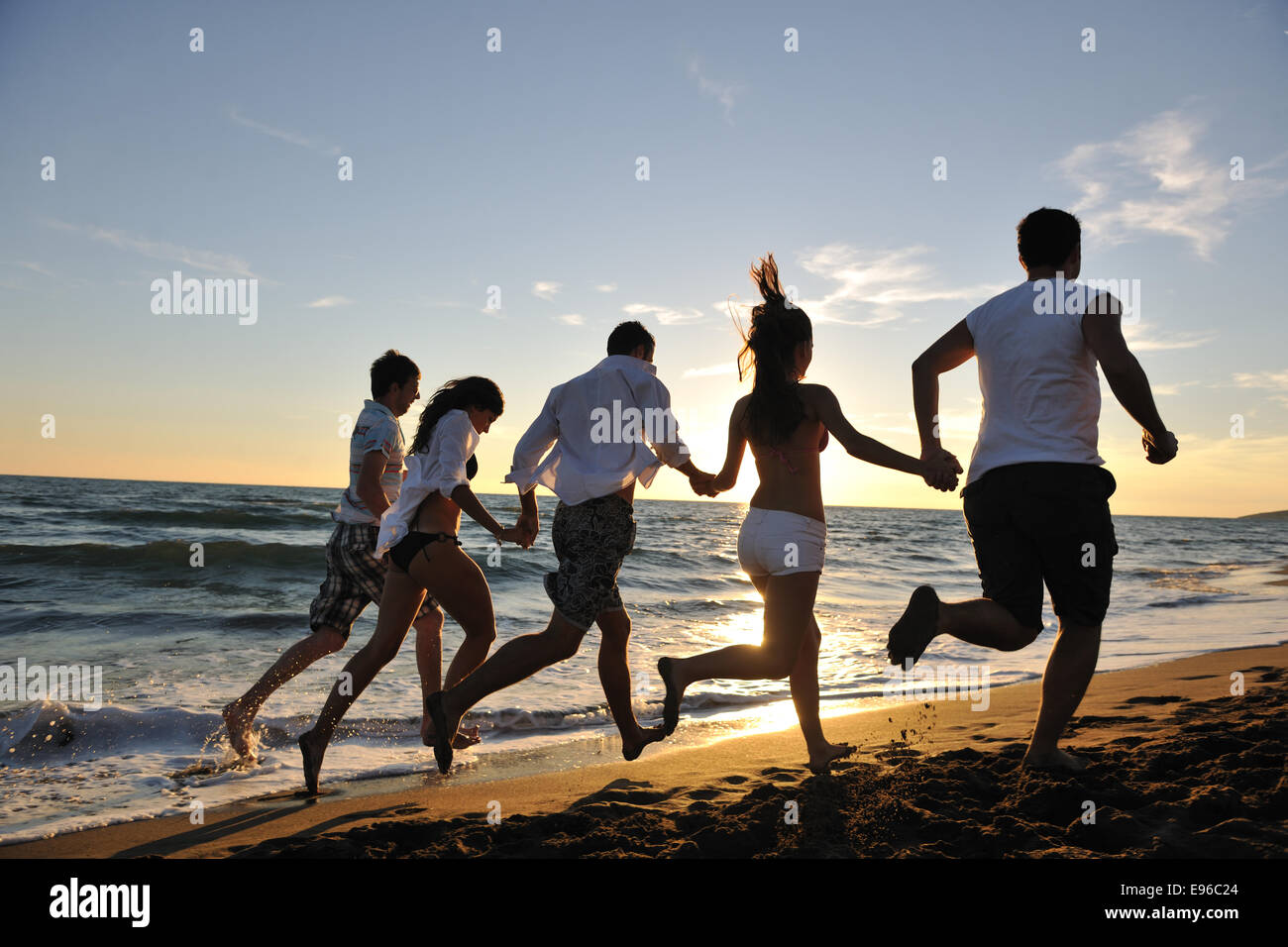 people group running on the beach Stock Photo - Alamy