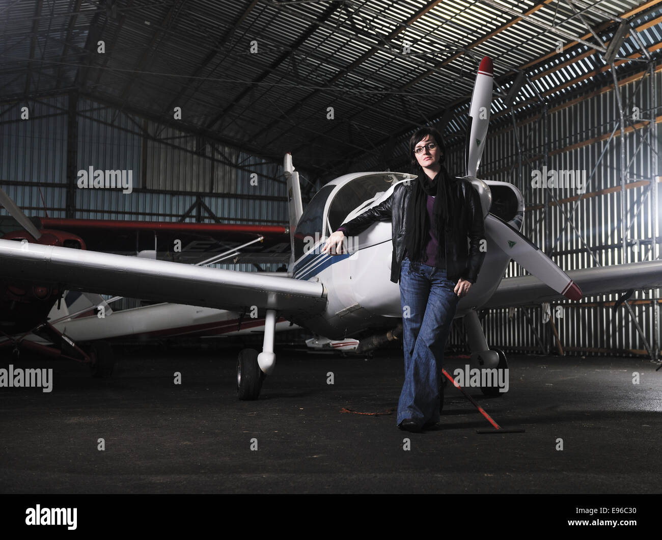 young woman with private airplane Stock Photo - Alamy