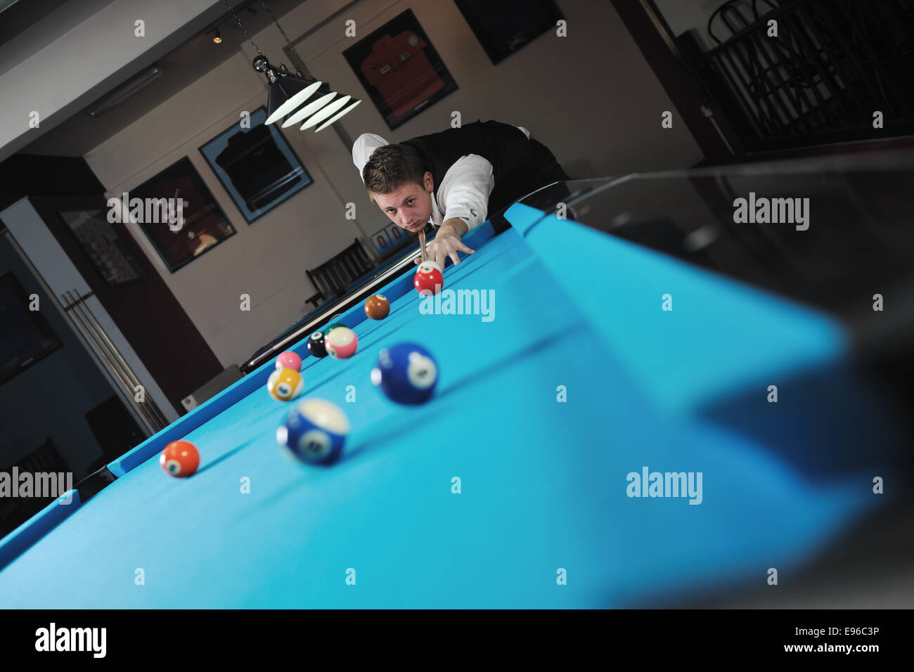 young man play pro billiard game Stock Photo - Alamy