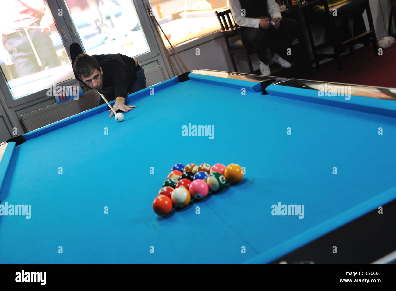 young man play pro billiard game Stock Photo - Alamy