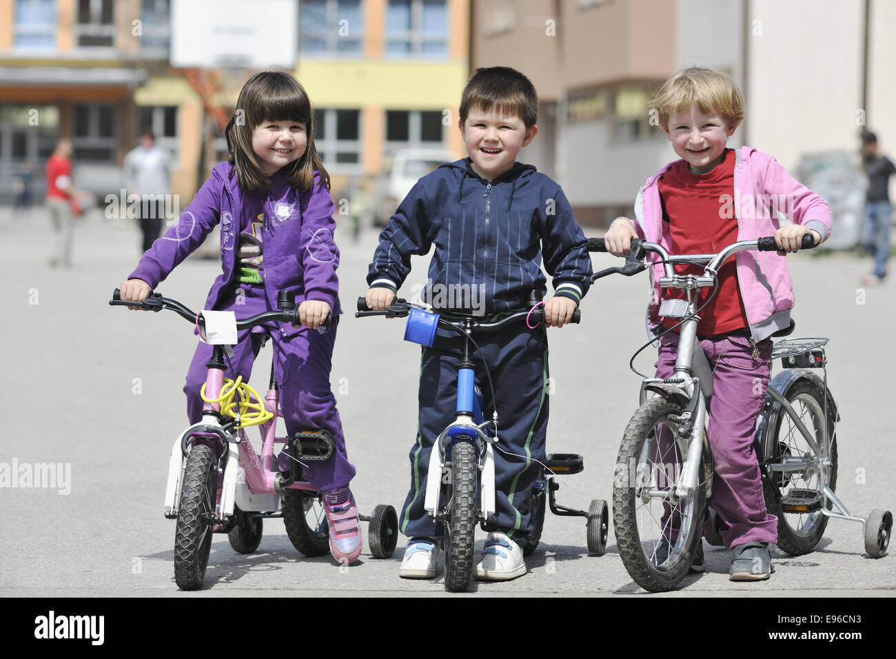 happy childrens group learning to drive bicycle Stock Photo - Alamy