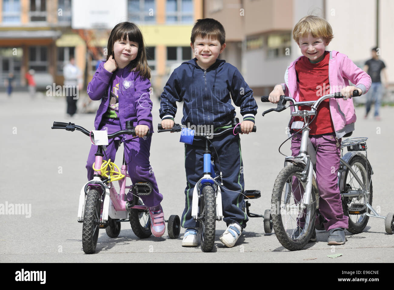 happy childrens group learning to drive bicycle Stock Photo - Alamy