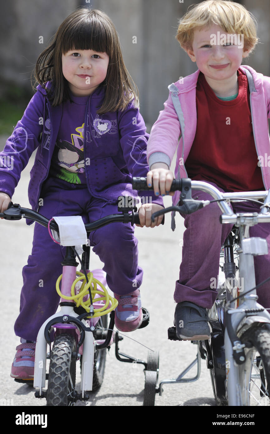 happy childrens group learning to drive bicycle Stock Photo - Alamy