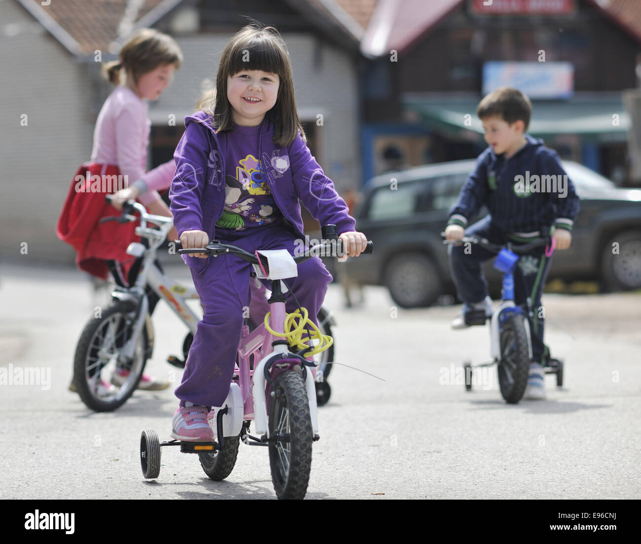 happy childrens group learning to drive bicycle Stock Photo - Alamy