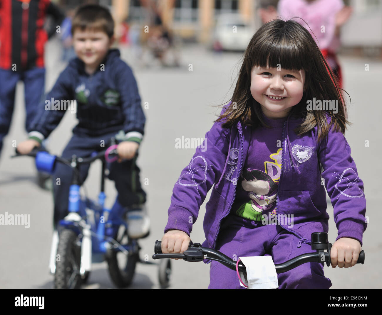 happy childrens group learning to drive bicycle Stock Photo - Alamy