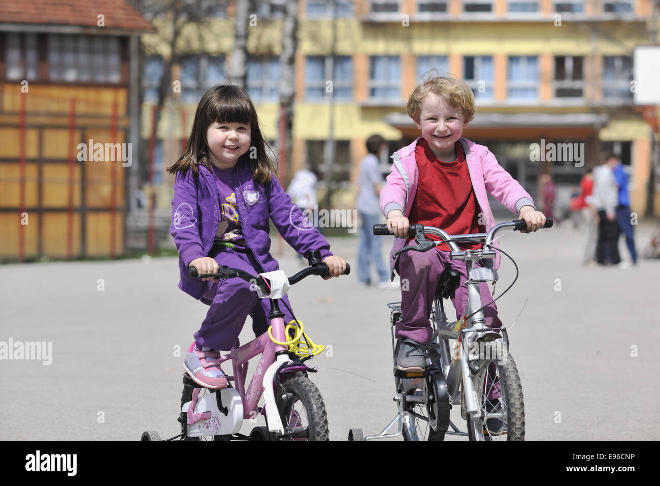 happy childrens group learning to drive bicycle Stock Photo - Alamy