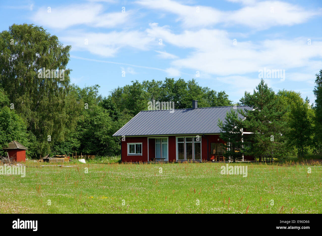 The house and field Stock Photo - Alamy