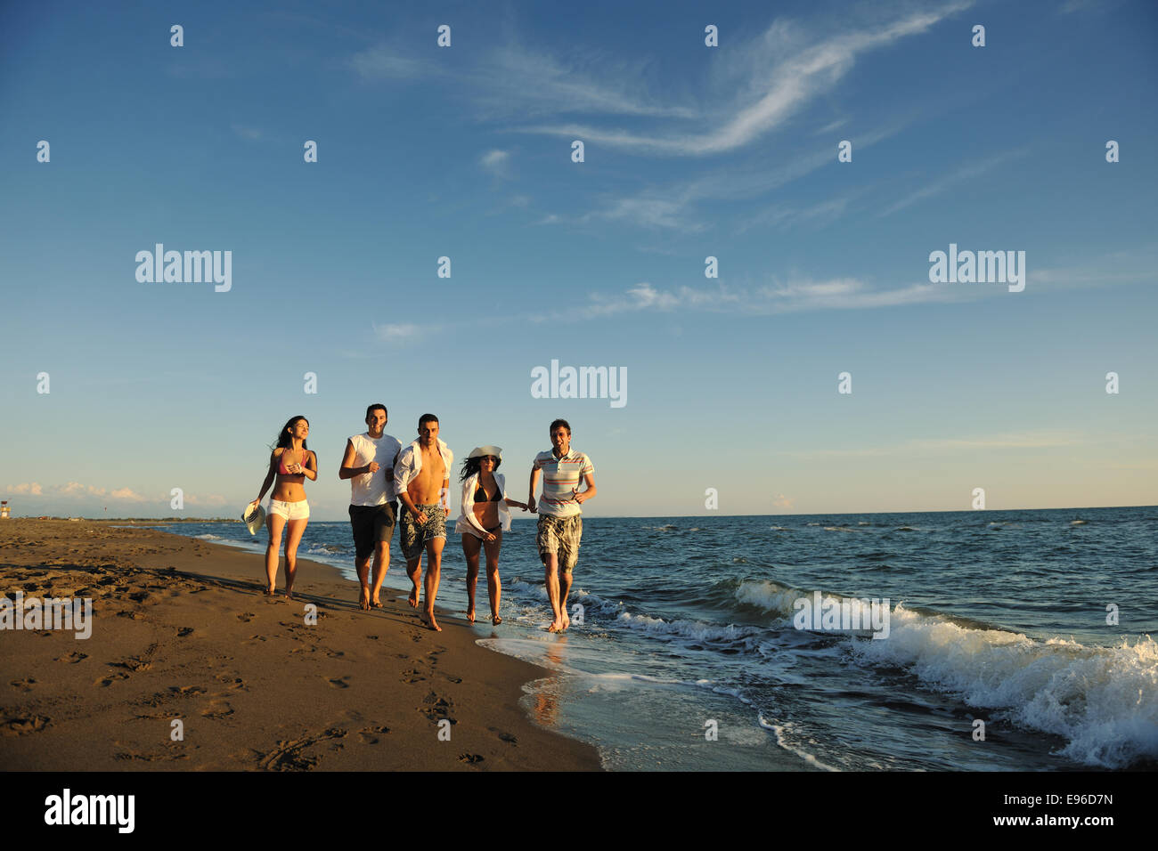 people group running on the beach Stock Photo - Alamy