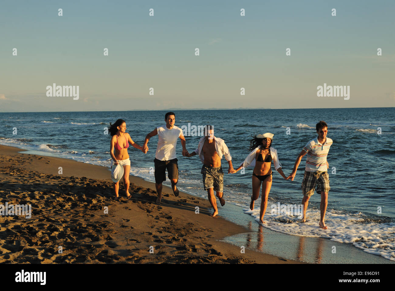 people group running on the beach Stock Photo - Alamy