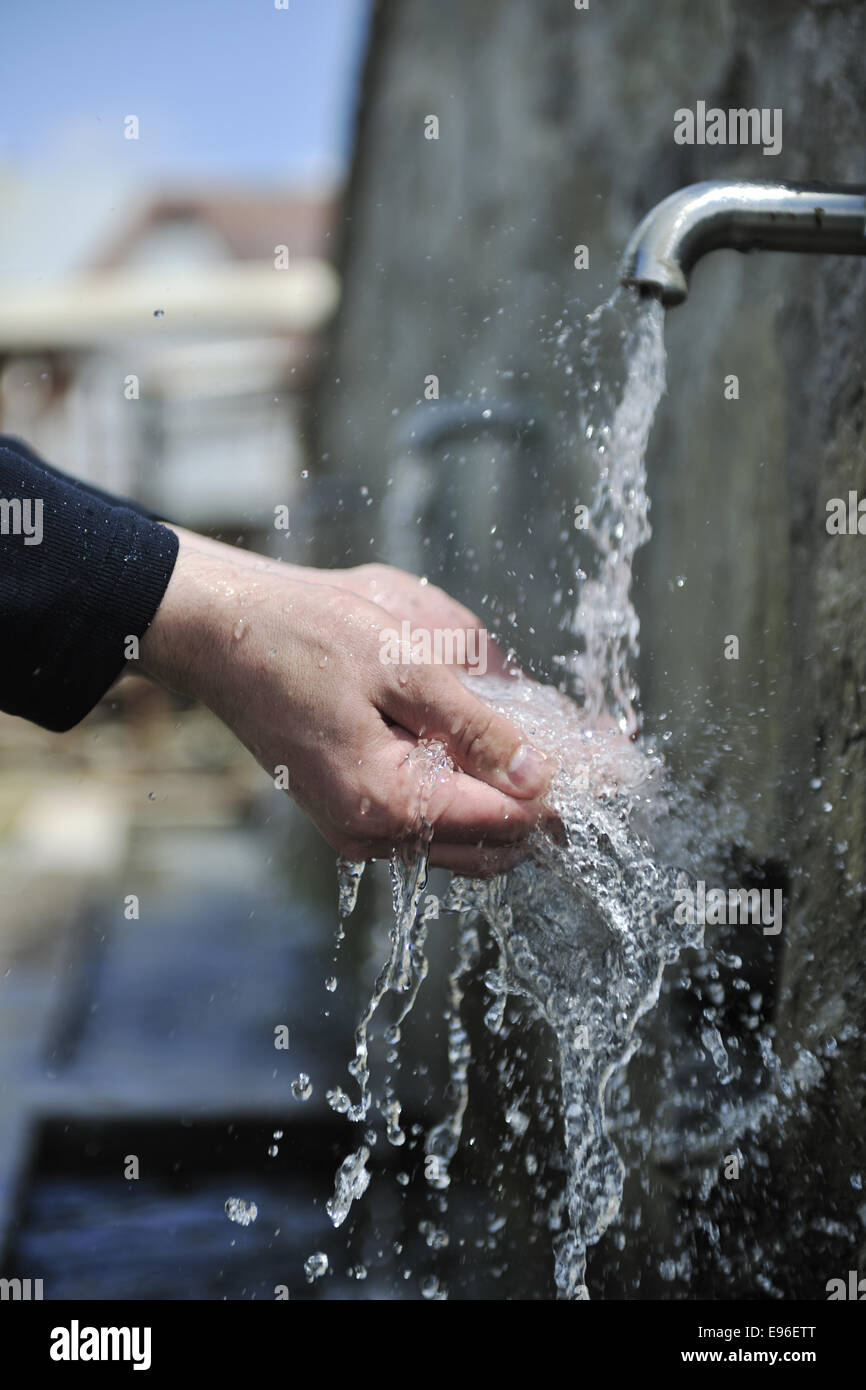 fresh mountain water falling on hands Stock Photo - Alamy