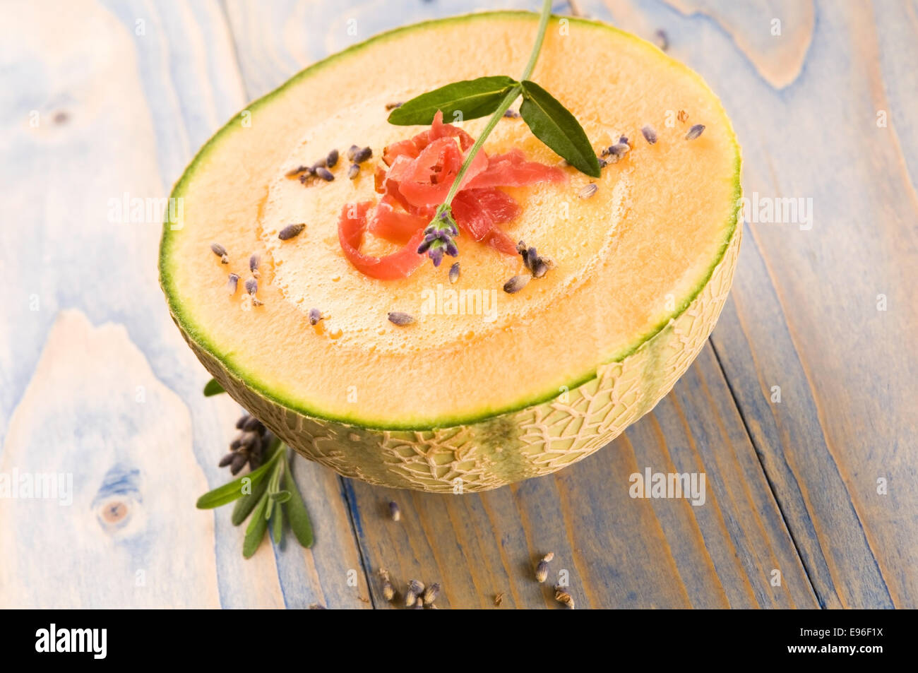 fresh melon soup with parma ham and lavender flower Stock Photo - Alamy