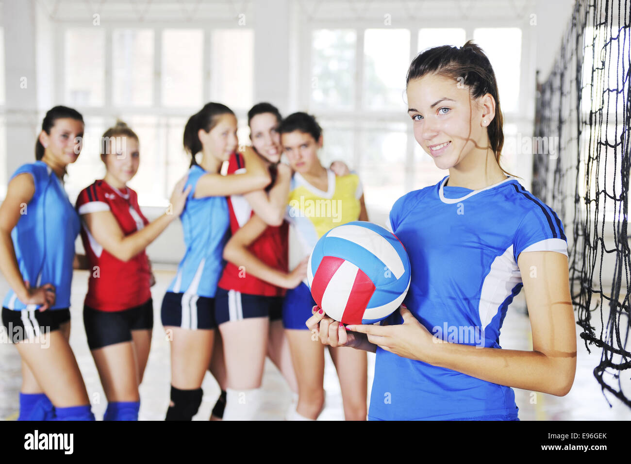 girls playing volleyball indoor game Stock Photo - Alamy