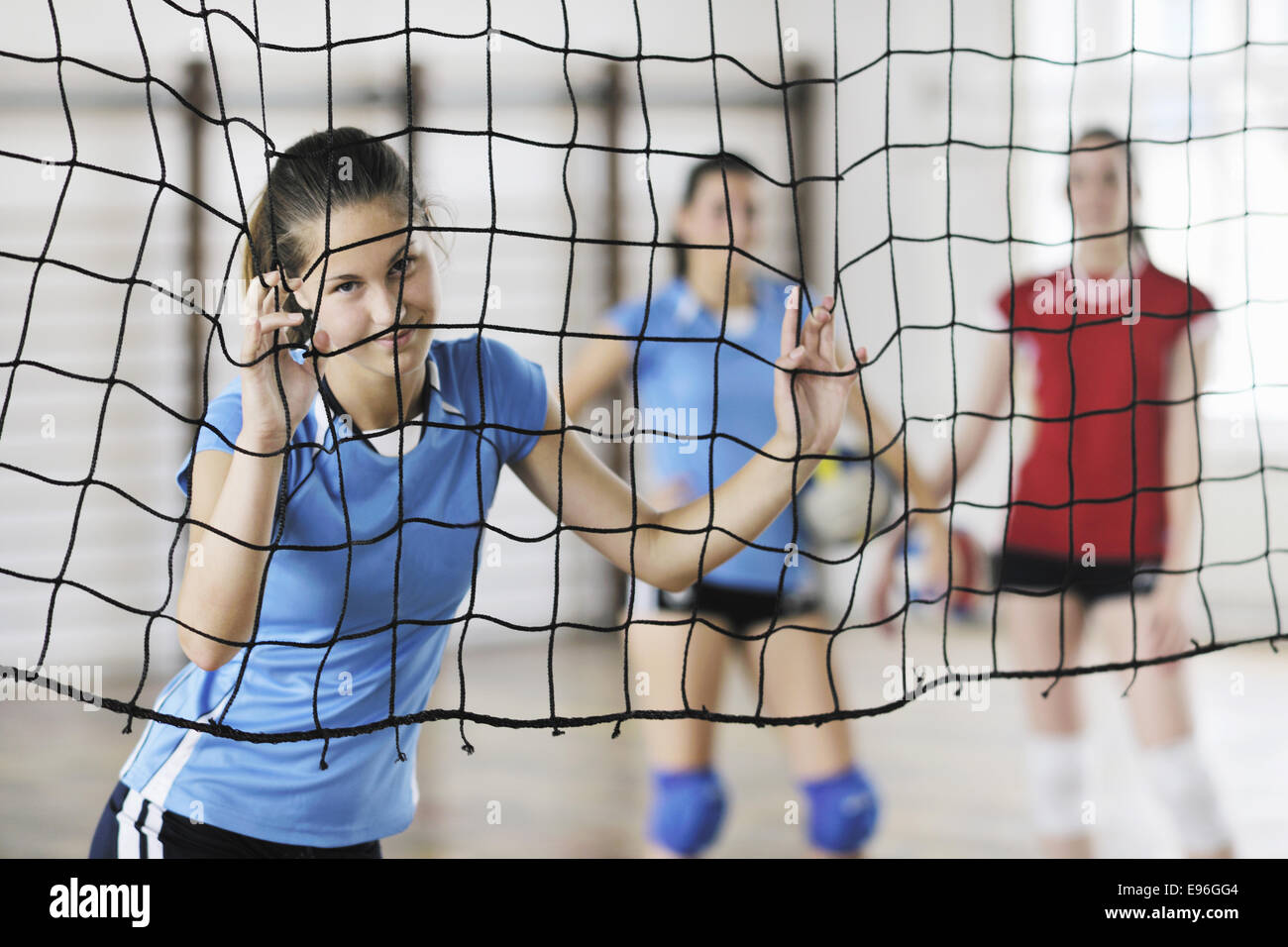 girls playing volleyball indoor game Stock Photo - Alamy