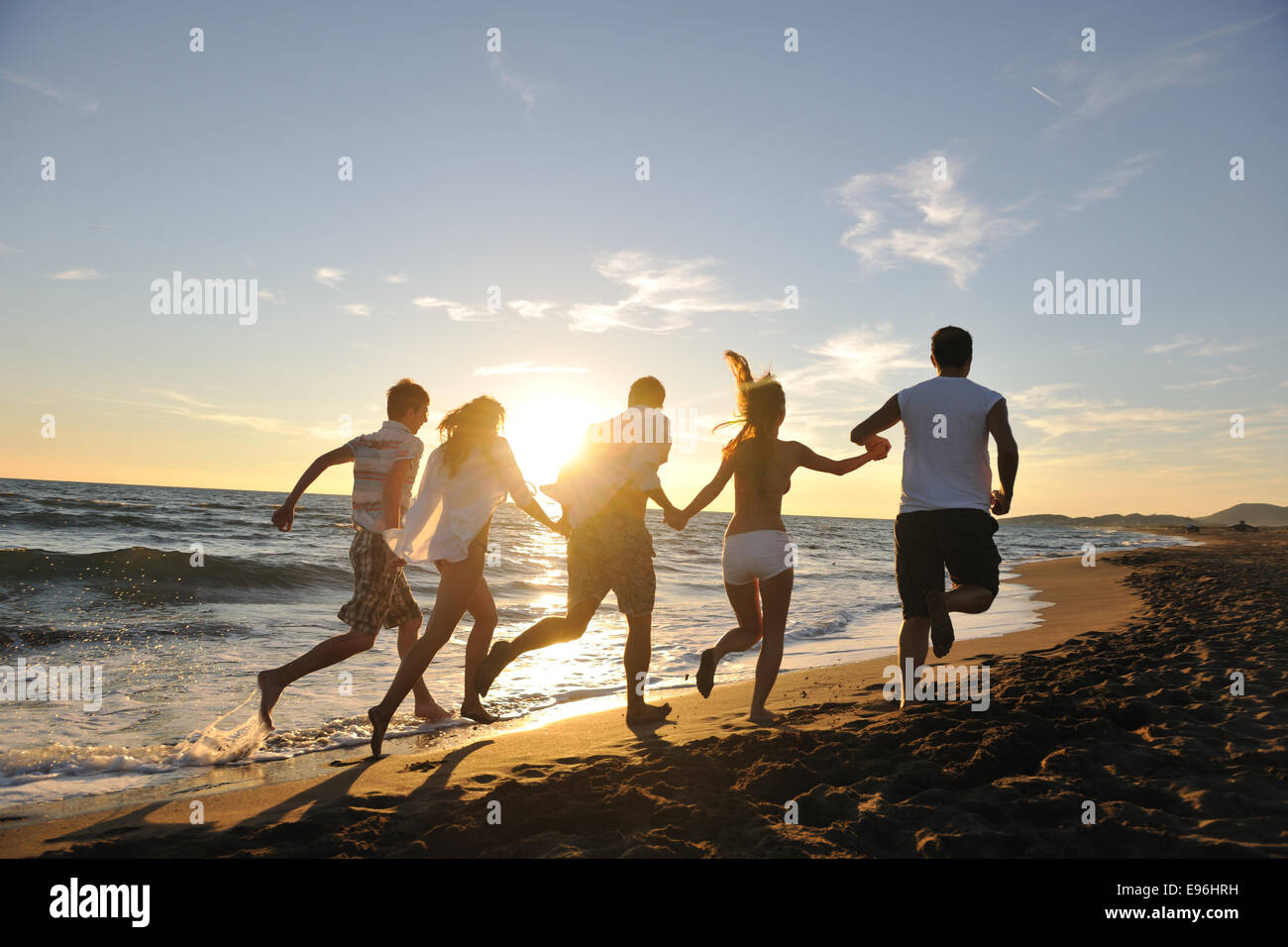 people group running on the beach Stock Photo - Alamy