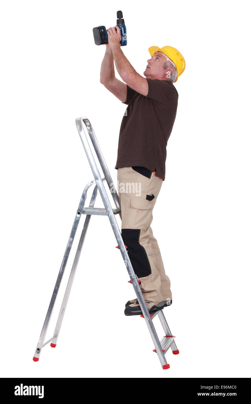 Handyman using screwdriver drill Cut Out Stock Images & Pictures - Alamy