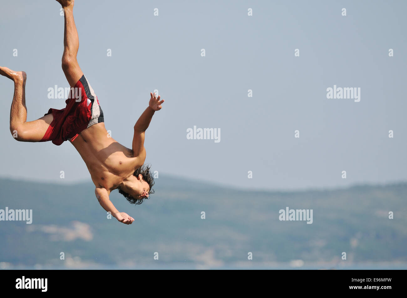 boy jump sea Stock Photo - Alamy