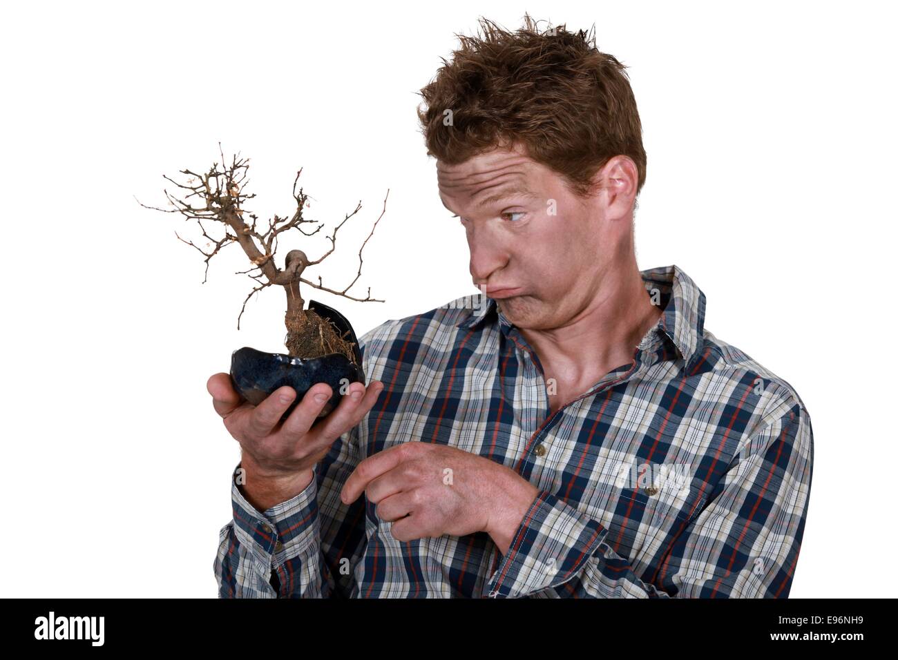 Electrocuted man holding a plant Stock Photo - Alamy