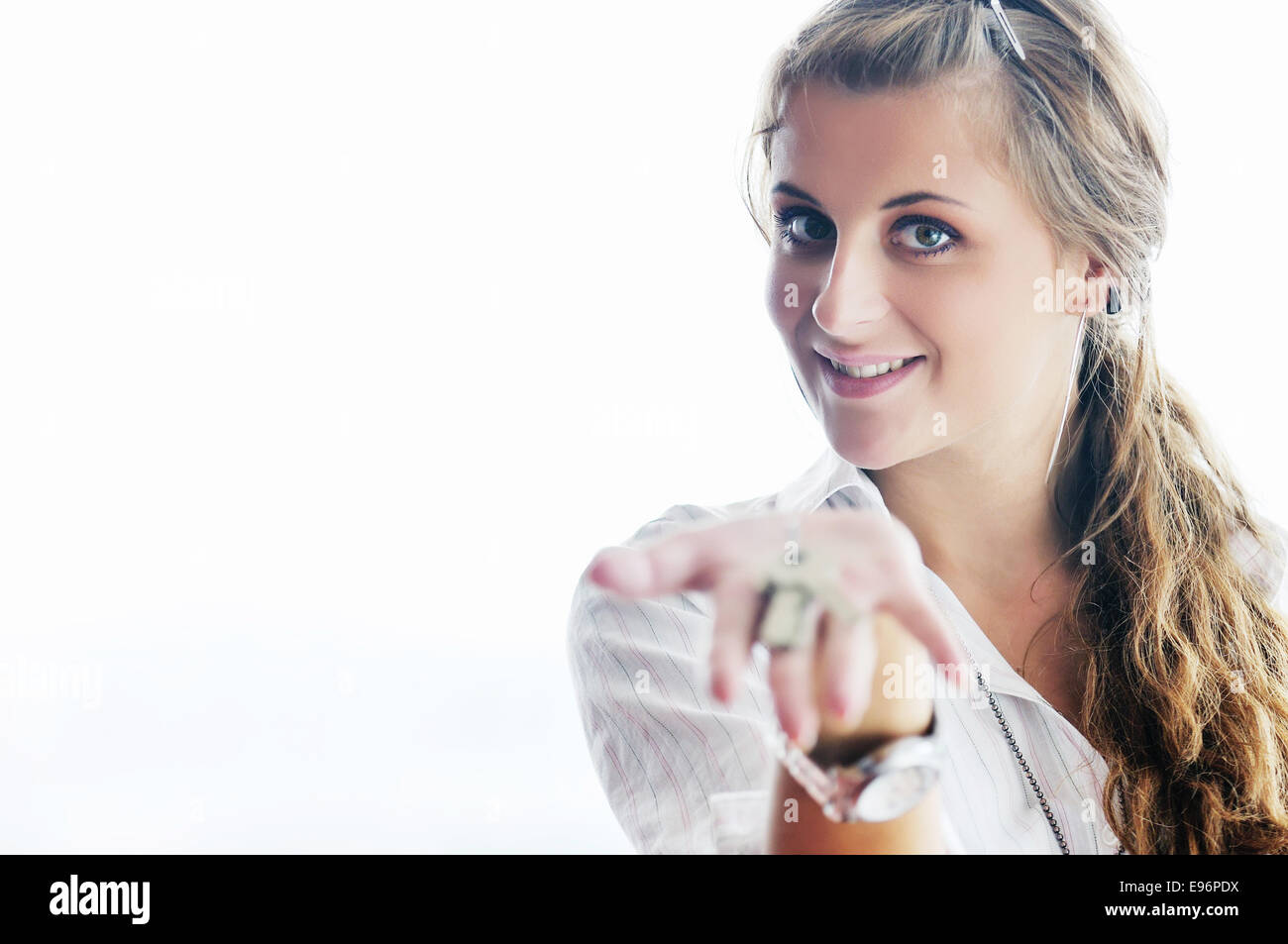 young woman throwing home keys in air Stock Photo - Alamy