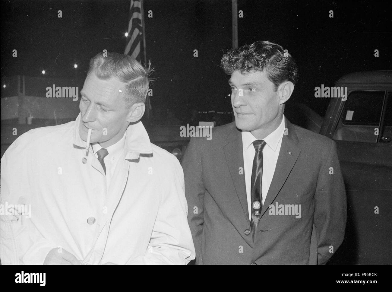 A photograph of a Ku Klux Klan rally held in 1965. The image captures a ...