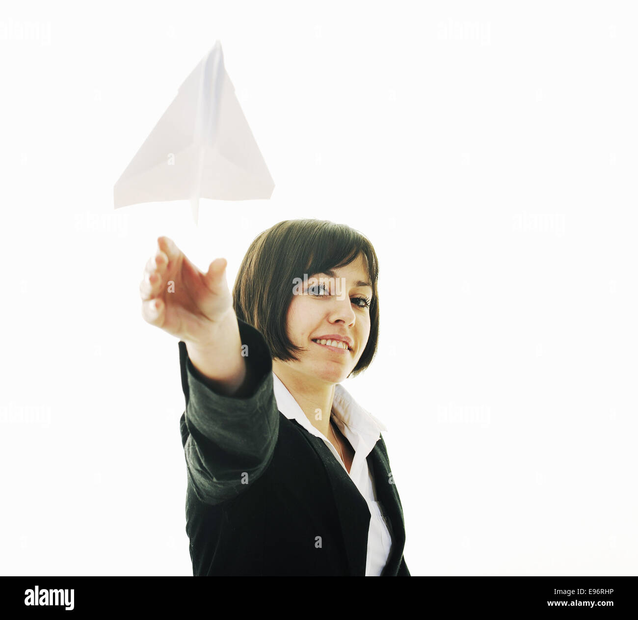 business woman throwing paper airplane Stock Photo - Alamy