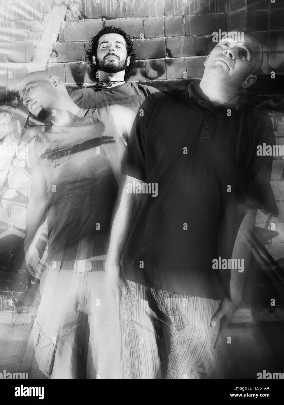 group of three young man jumping in air Stock Photo - Alamy