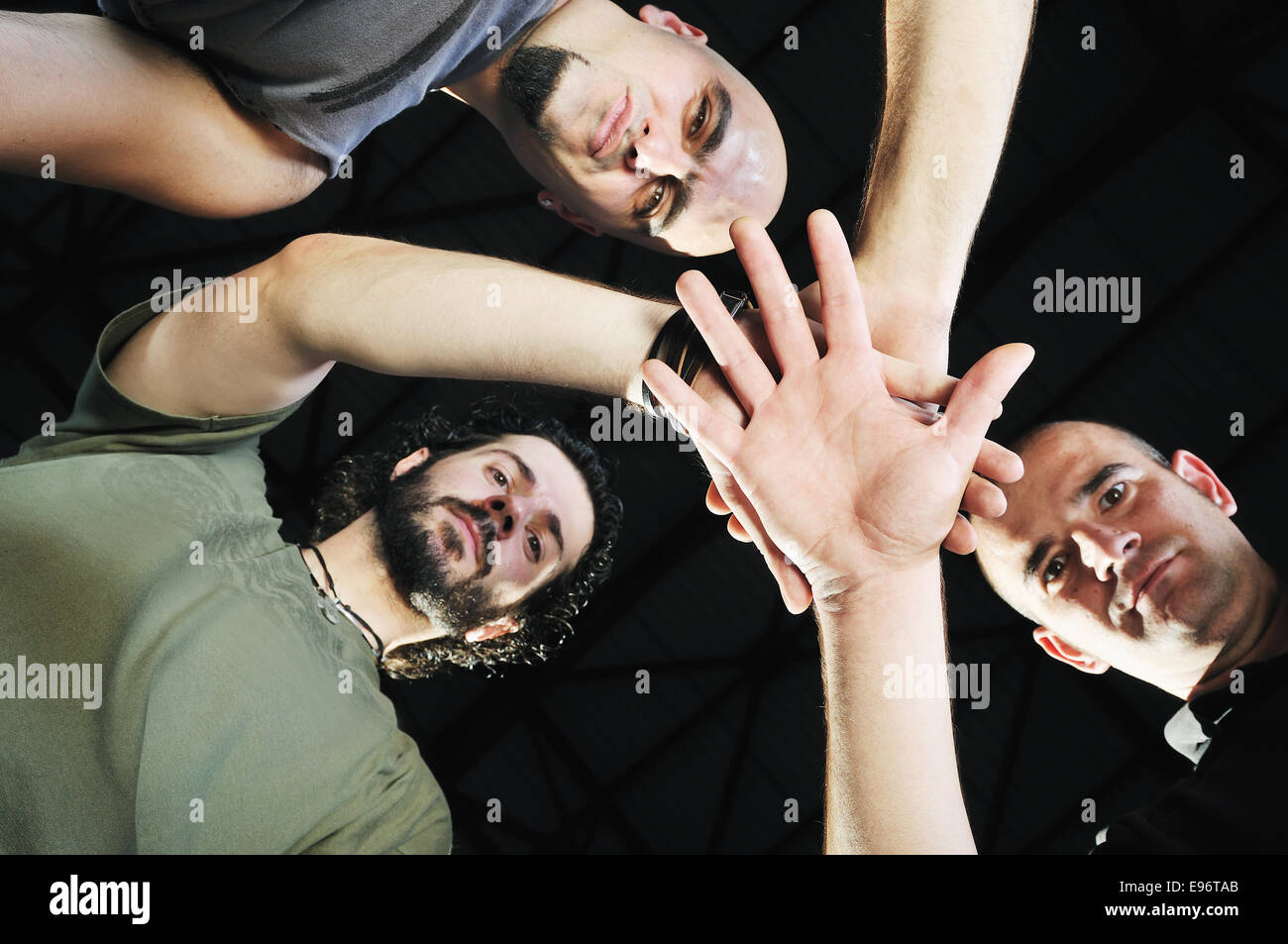 three man group Stock Photo - Alamy