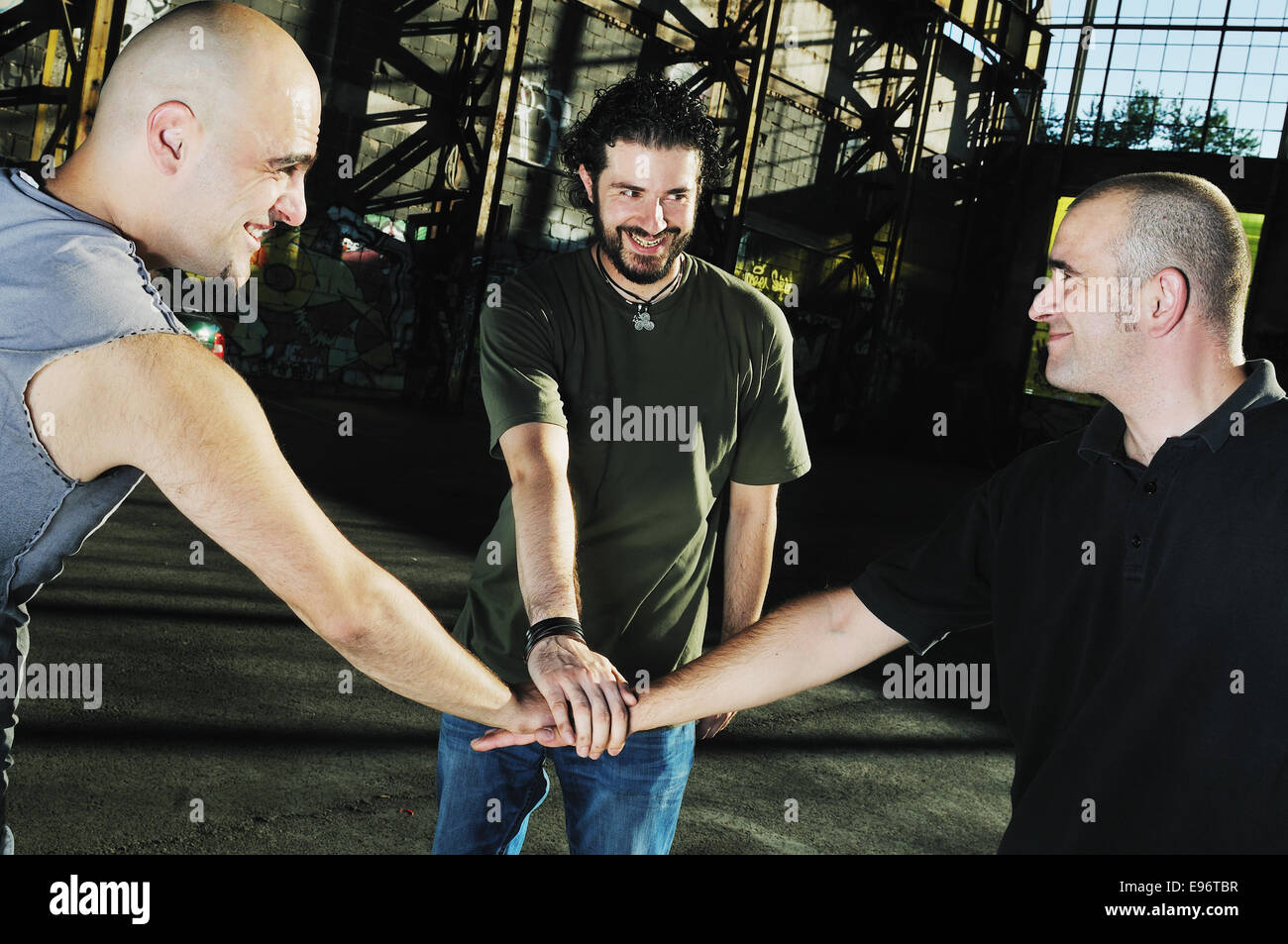 three man group Stock Photo - Alamy