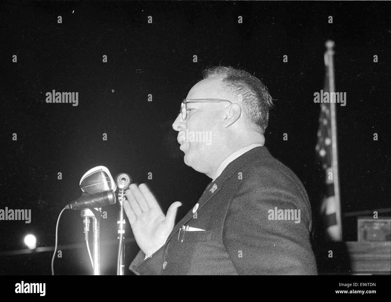 This image depicts a Ku Klux Klan rally in 1965, showcasing a moment in ...