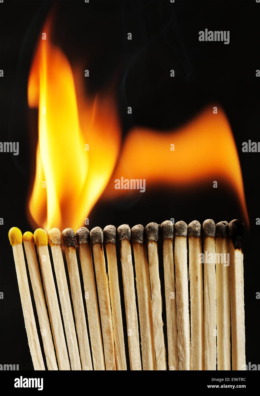 burning matchsticks on black background Stock Photo - Alamy