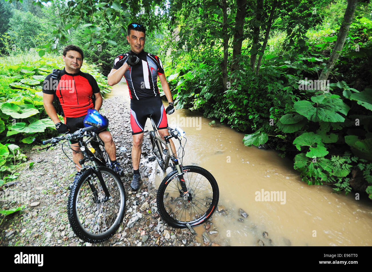 friendship and travel on mountain bike Stock Photo - Alamy