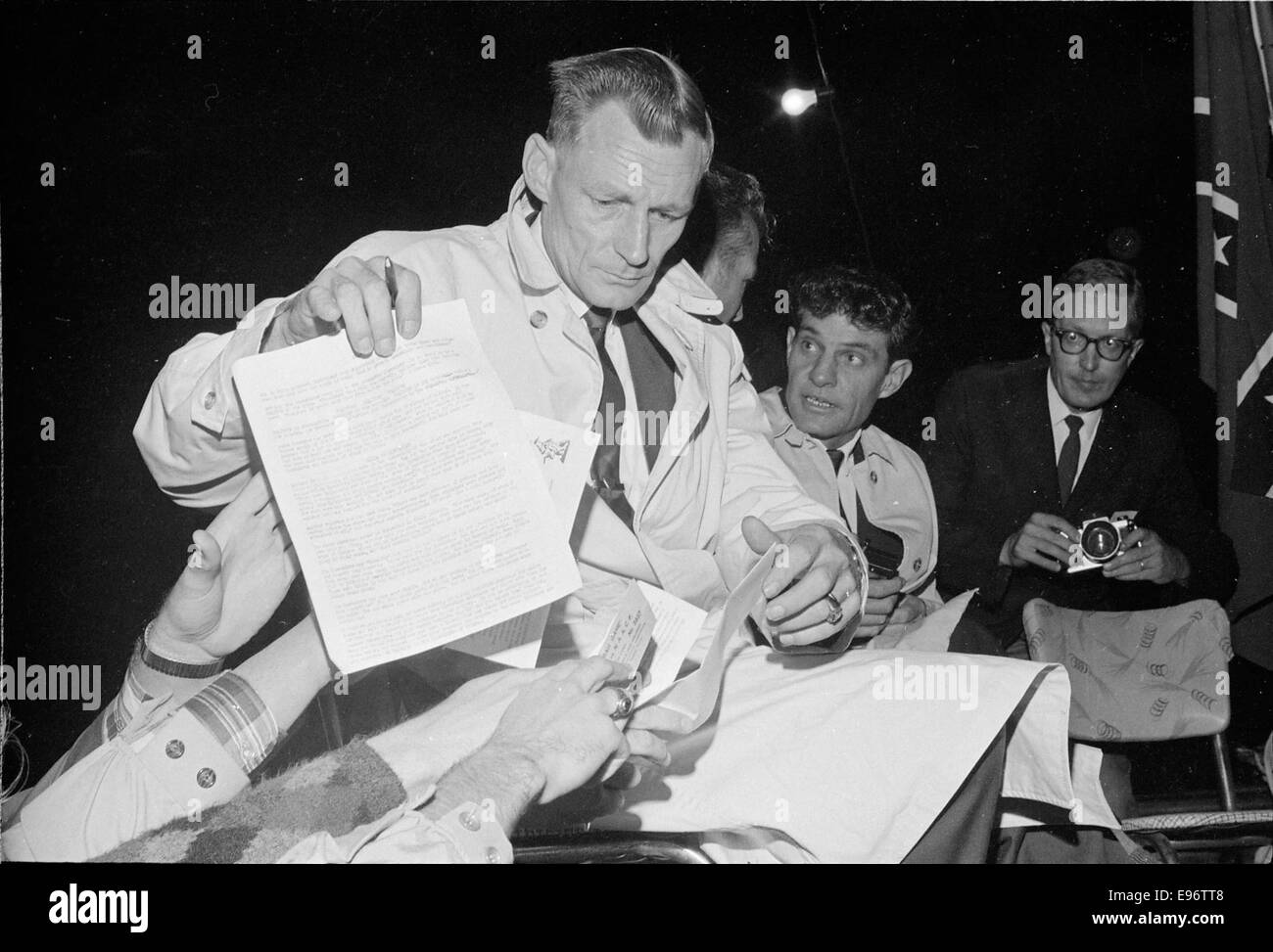This photograph captures a Ku Klux Klan rally held in 1965, a period ...