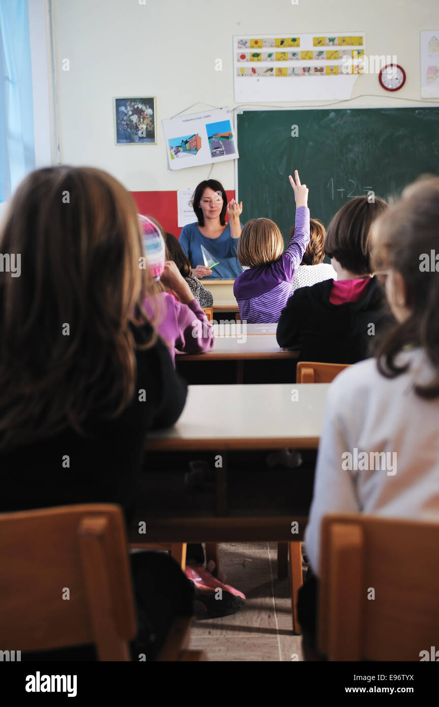 happy teacher in school classroom Stock Photo - Alamy