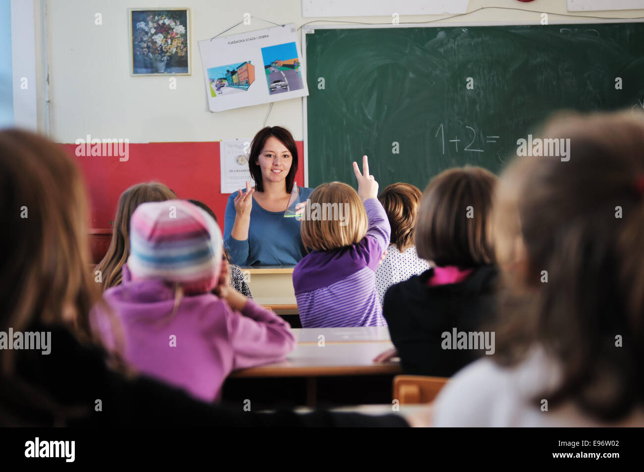 happy teacher in school classroom Stock Photo - Alamy