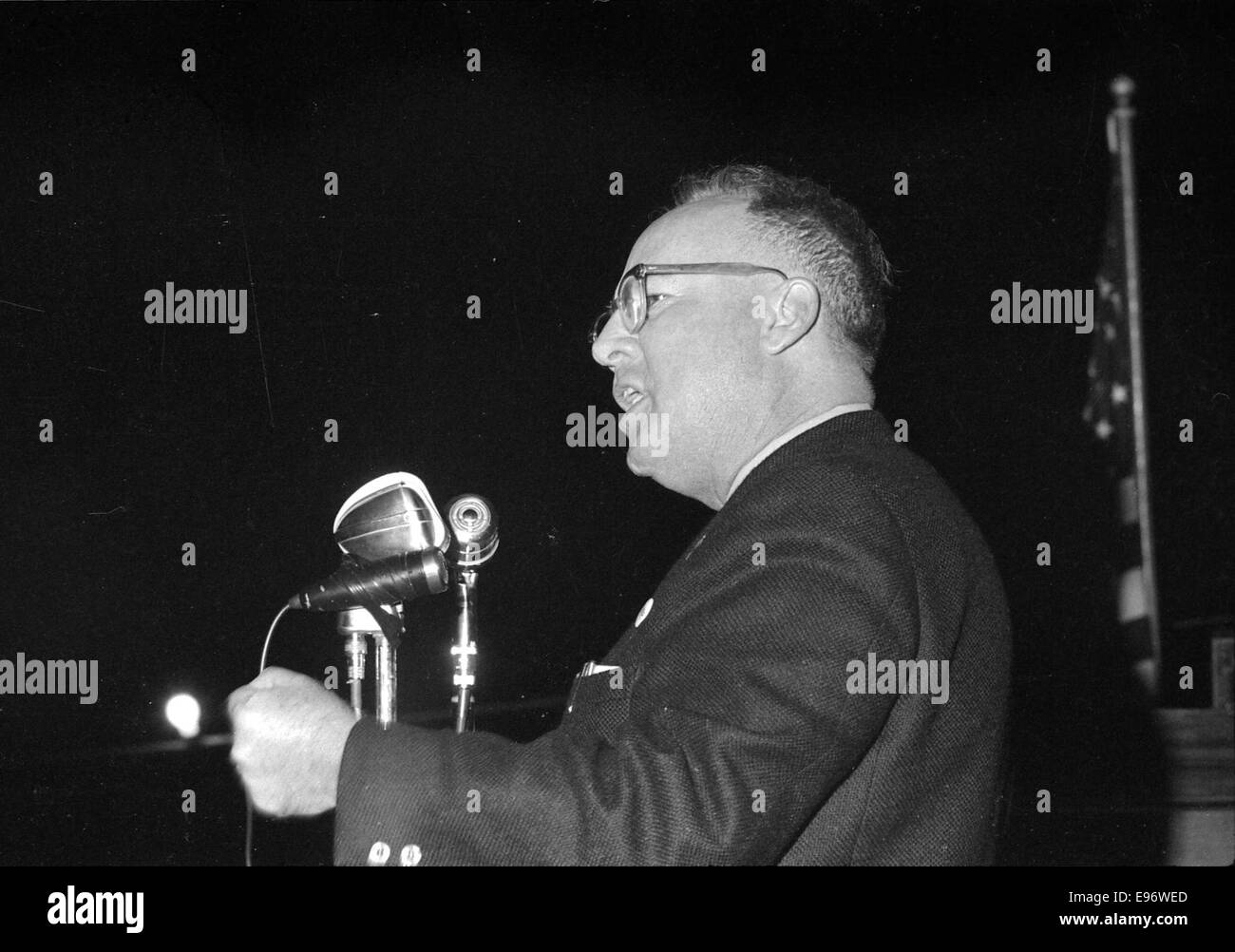 A photograph documenting a Ku Klux Klan rally in 1965, capturing the ...