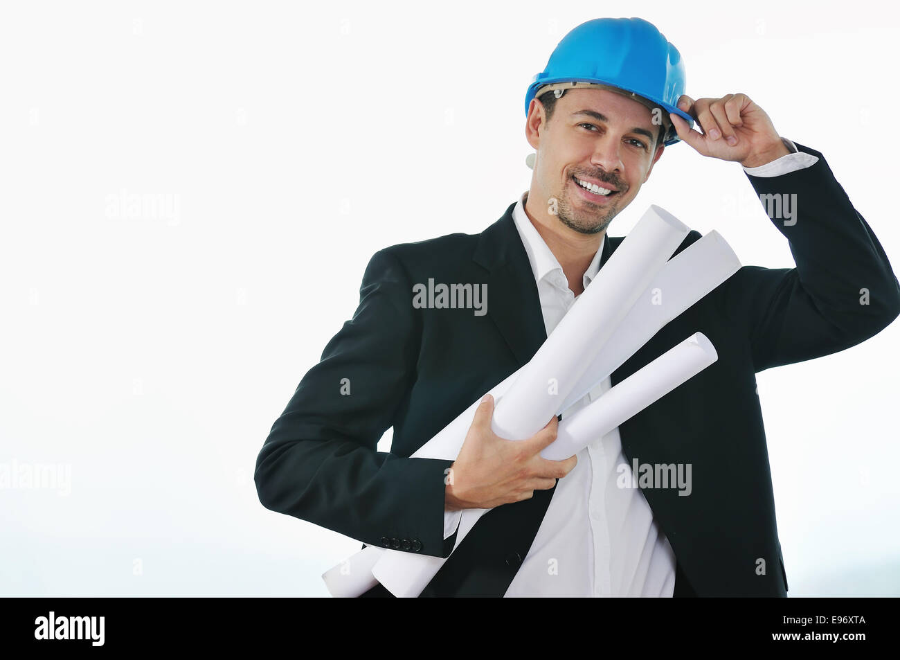 Smiling architect touching blueprints hi-res stock photography and ...
