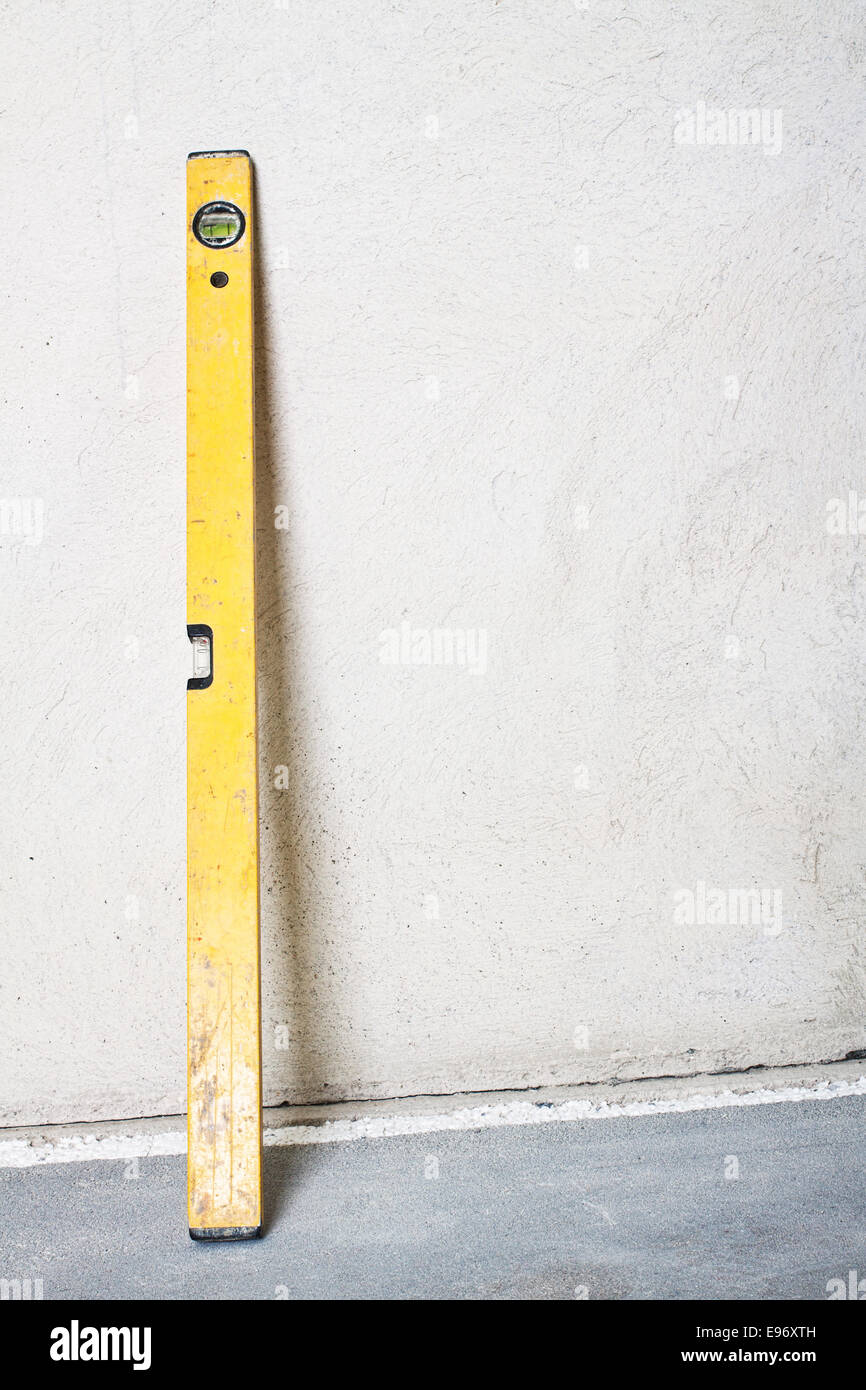 old dirty level on concrete wall Stock Photo - Alamy