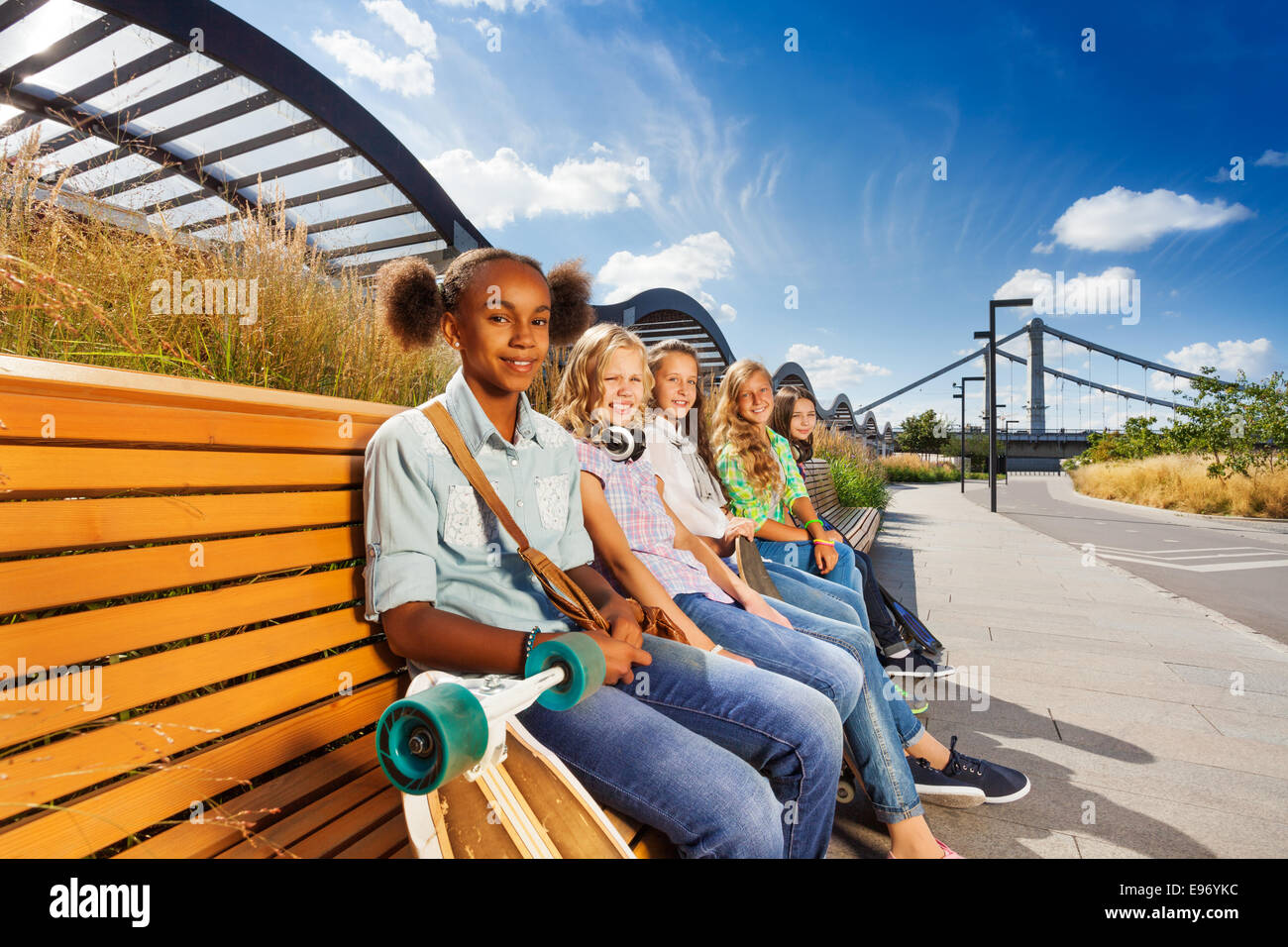 Beautiful girls sitting in row hi-res stock photography and images - Alamy