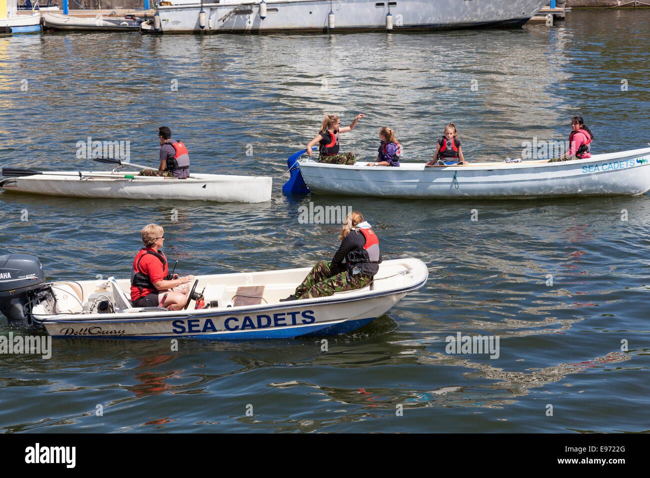 Girl Sea Cadets in rowing boats in the floating harbour in Bristol ...